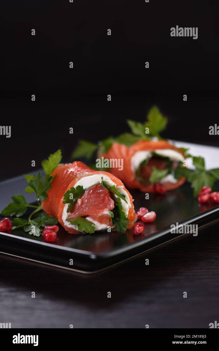 Salmon strip with cream cheese and grapefruit, rolled up. These bite ...