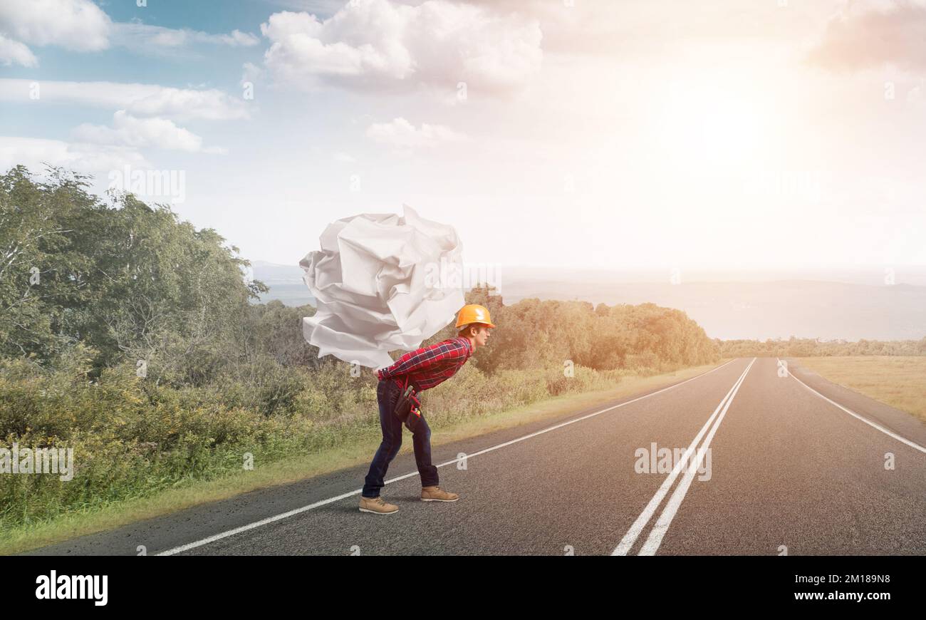 Engineer man carry load Stock Photo - Alamy