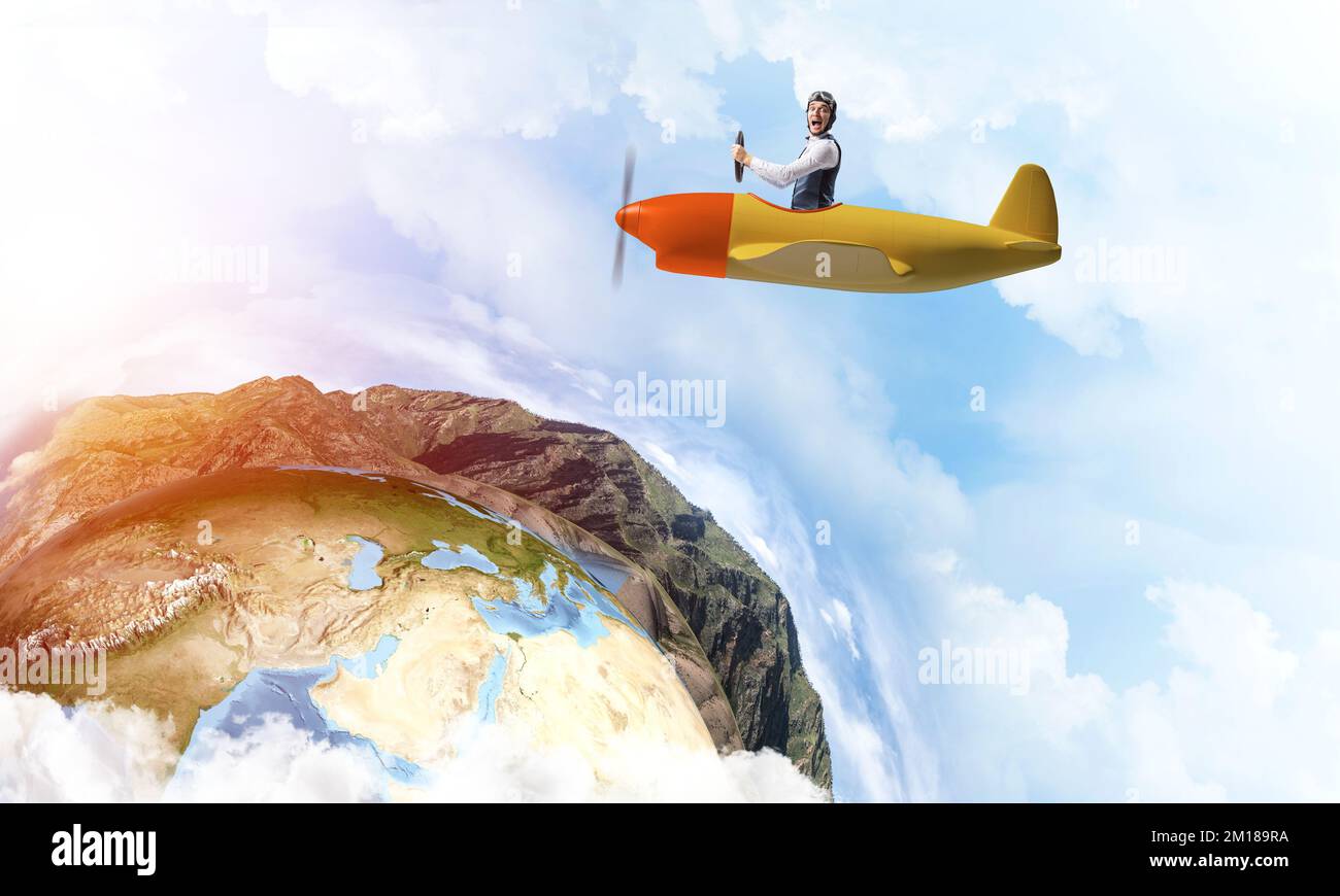 Aviator in leather helmet driving small plane Stock Photo - Alamy