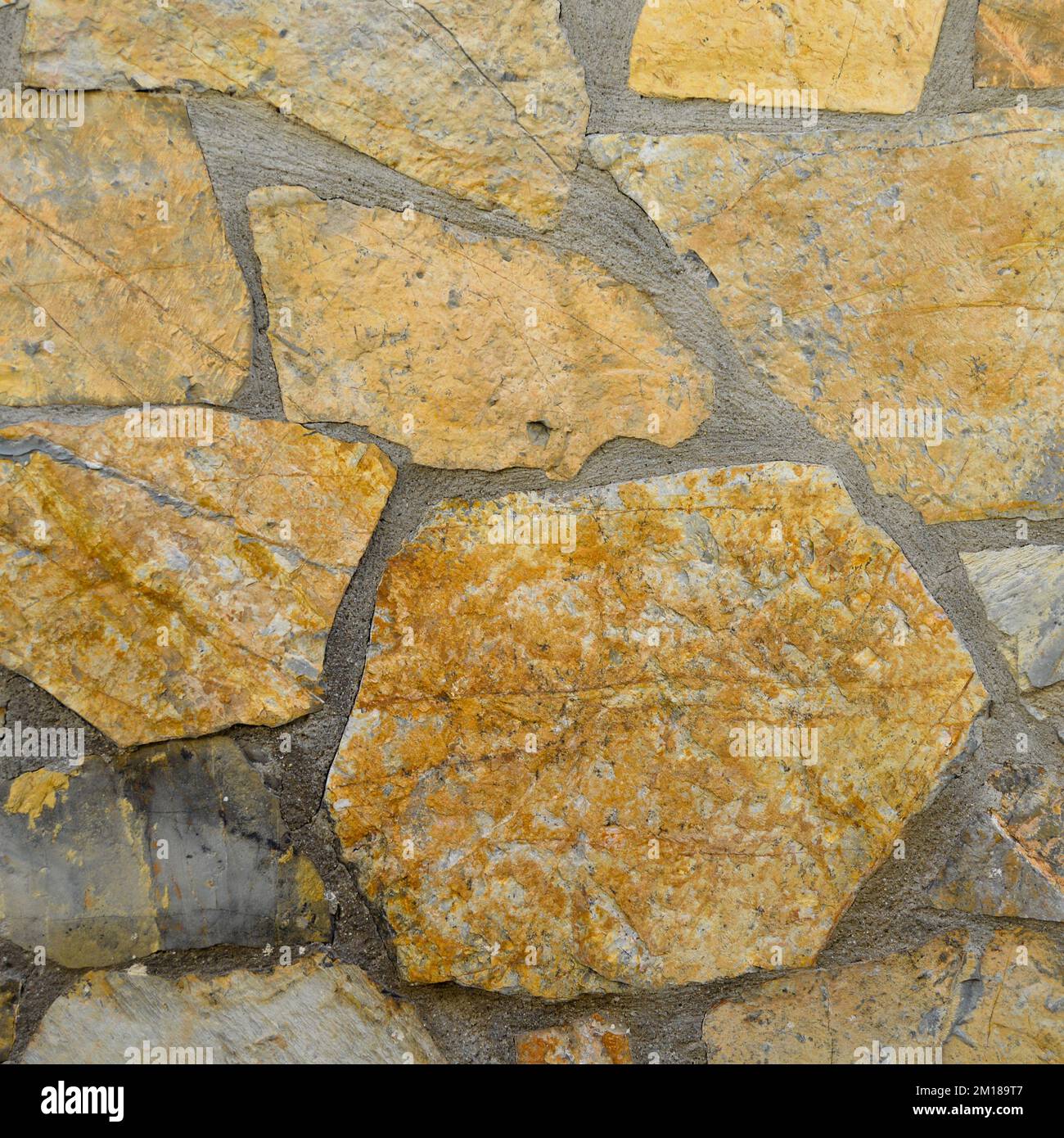 Sturdy yellow and beige cut stone wall, good for backgrounds, seamless ...