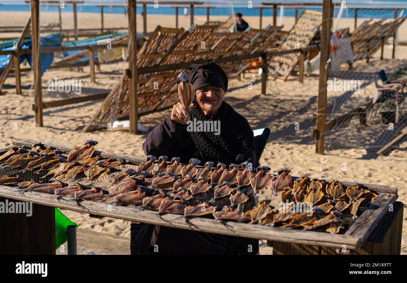 Nazare, Portugal - 09.12.2022: old lady in black sells dry fish Stock ...