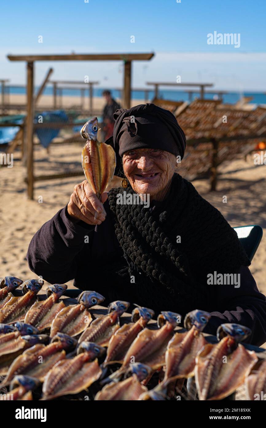 Nazare, Portugal - 09.12.2022: old lady in black sells dry fish Stock ...