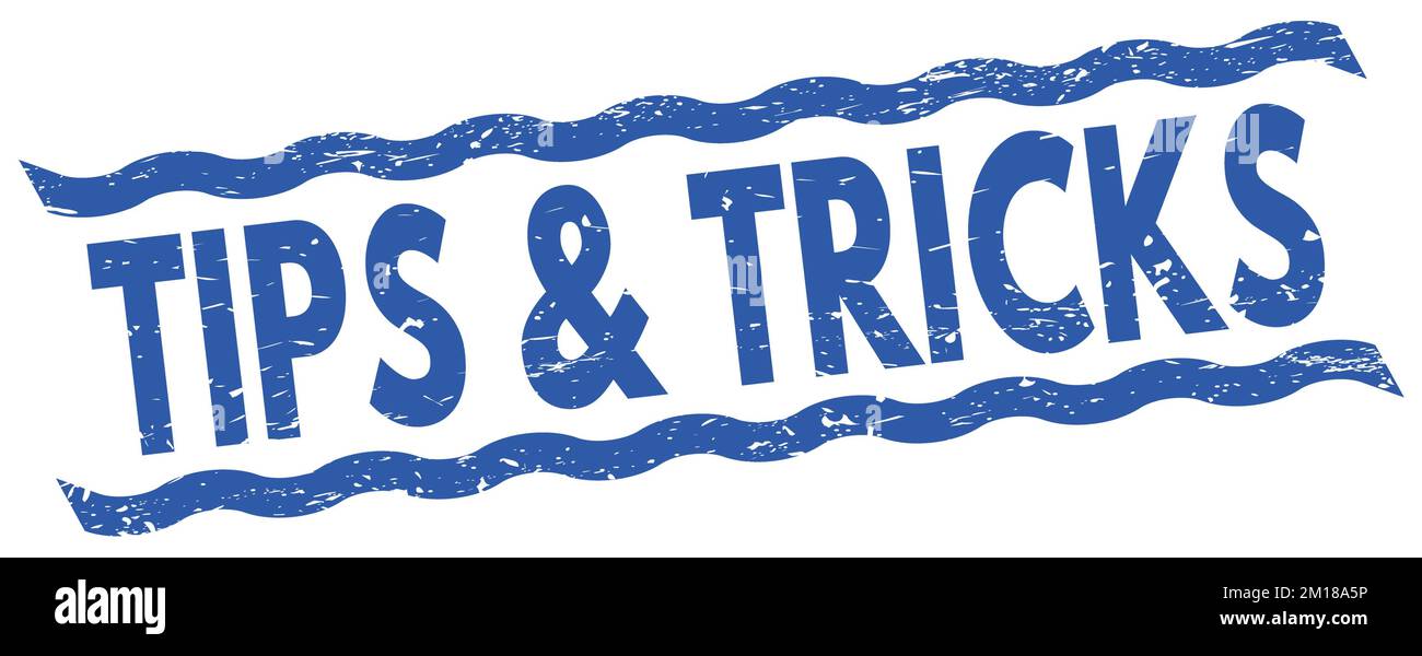 TIPS & TRICKS text written on blue lines stamp sign Stock Photo - Alamy