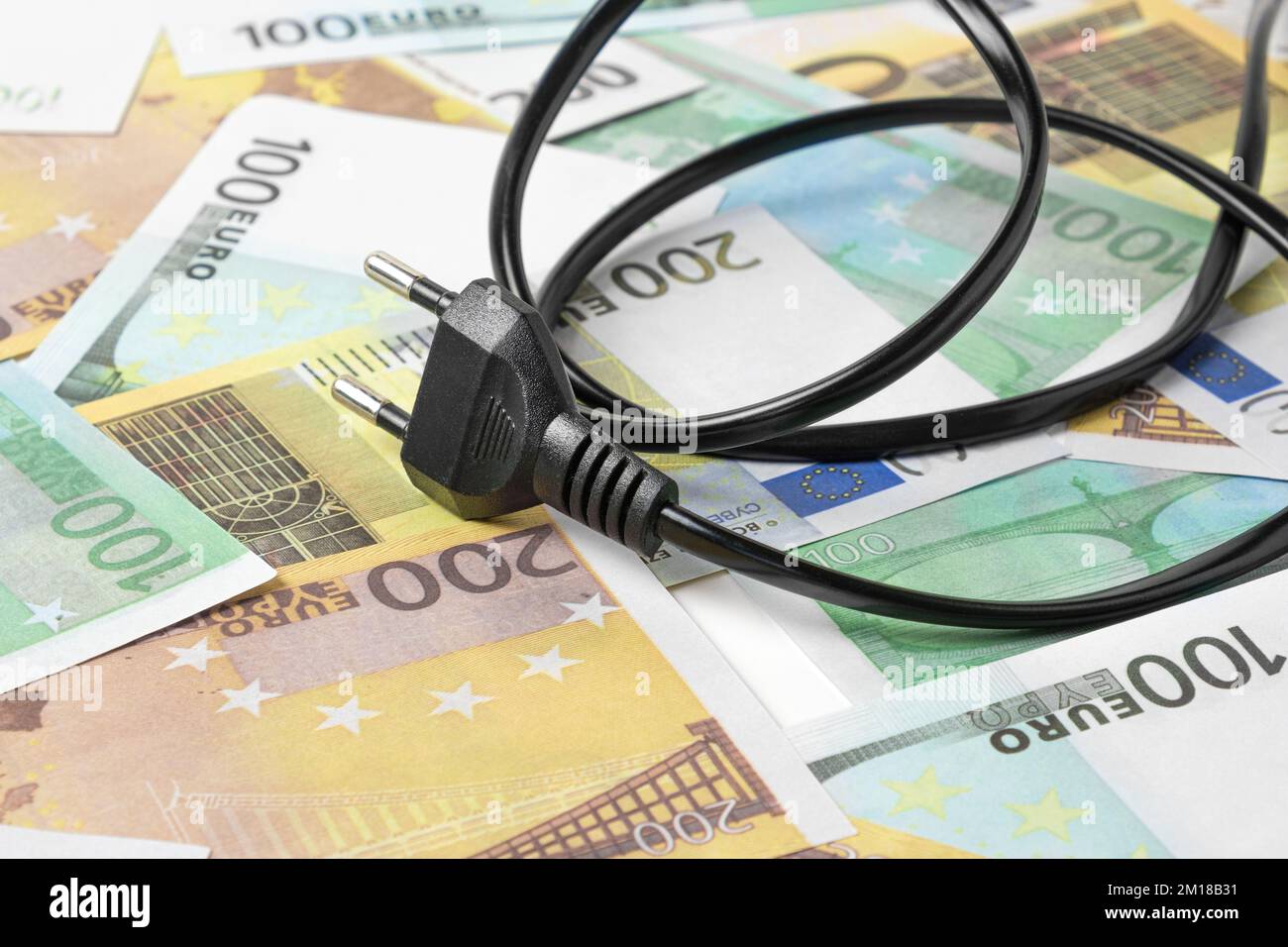 Power plug on Euro Banknotes Background. Increasing Consumption. Cost ...