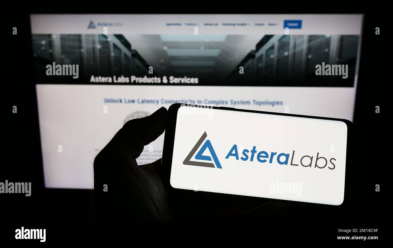 Person holding mobile phone with logo of American semiconductor company ...