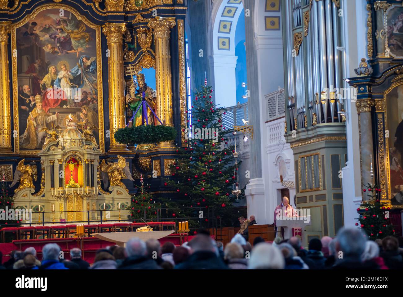 Altoetting,Germany-December 11,2022: A priest reads the evangelium ...