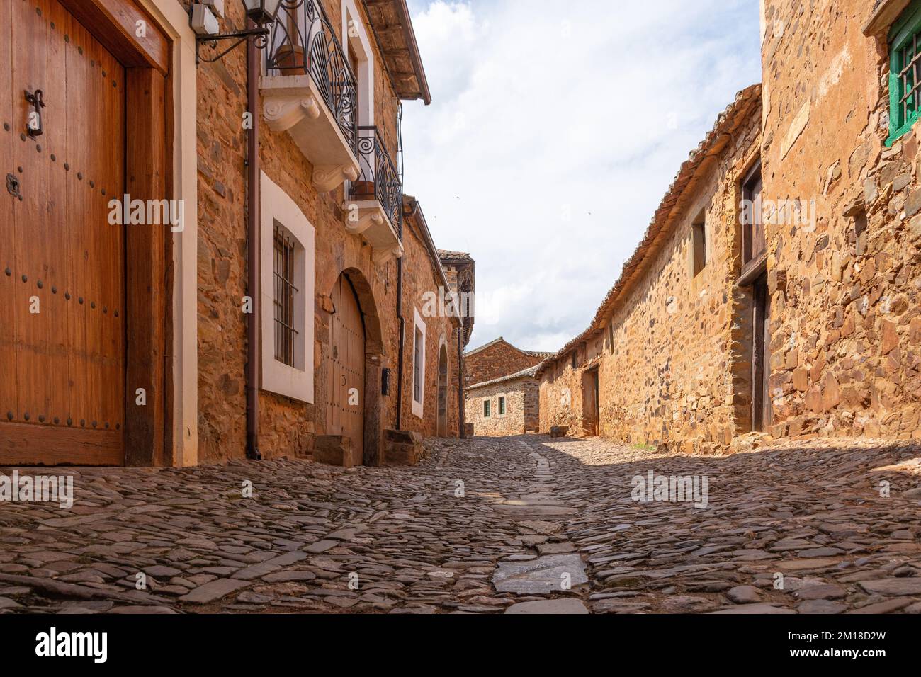 A beautiful view of the medieval street lined with houses in Castrillo ...