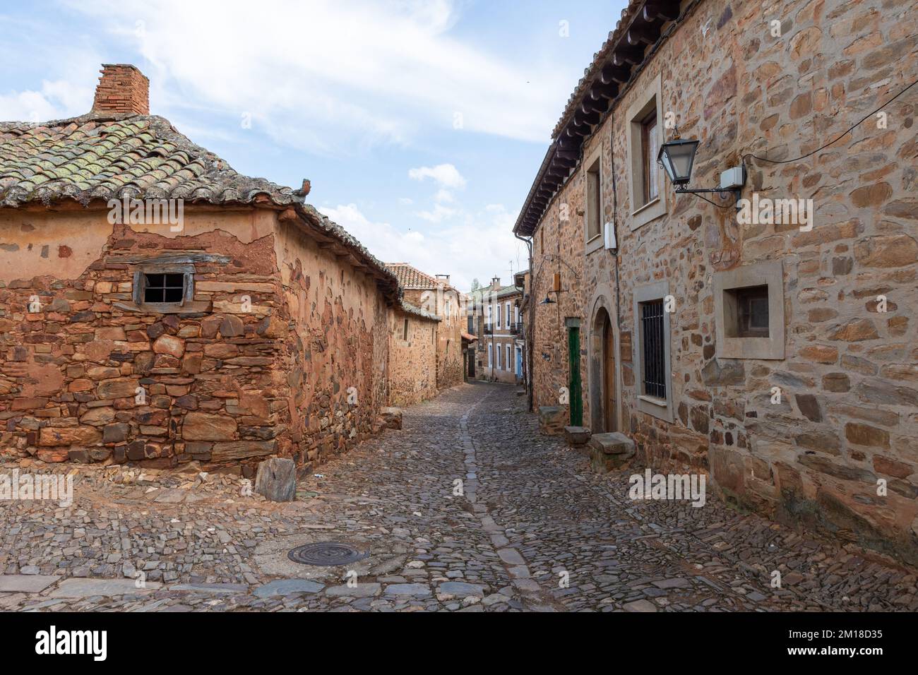 A beautiful view of the medieval street lined with houses in Castrillo ...
