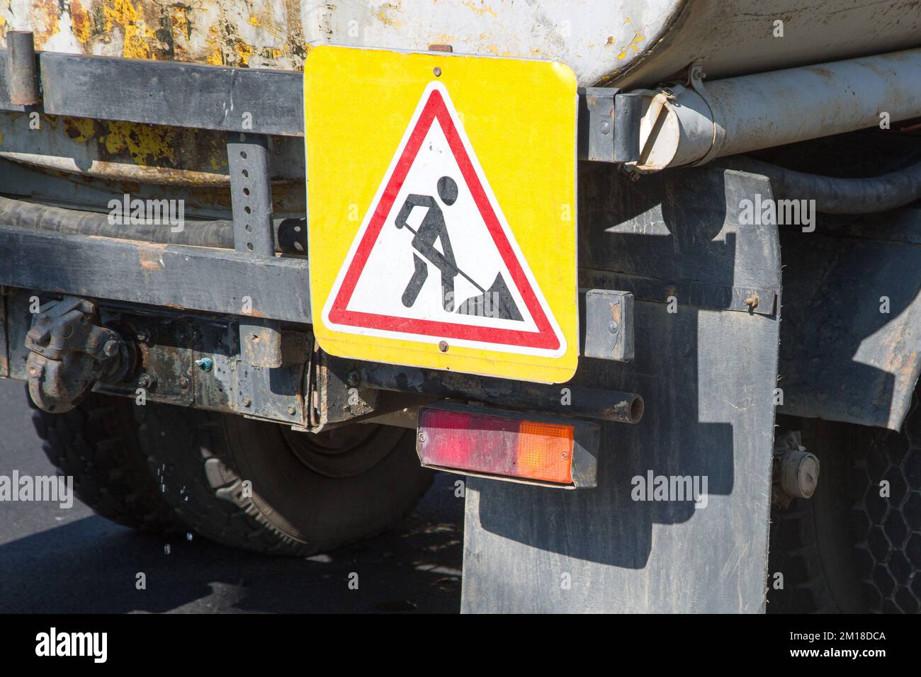 Road warning signs on repair vehicles, close-up Stock Photo - Alamy