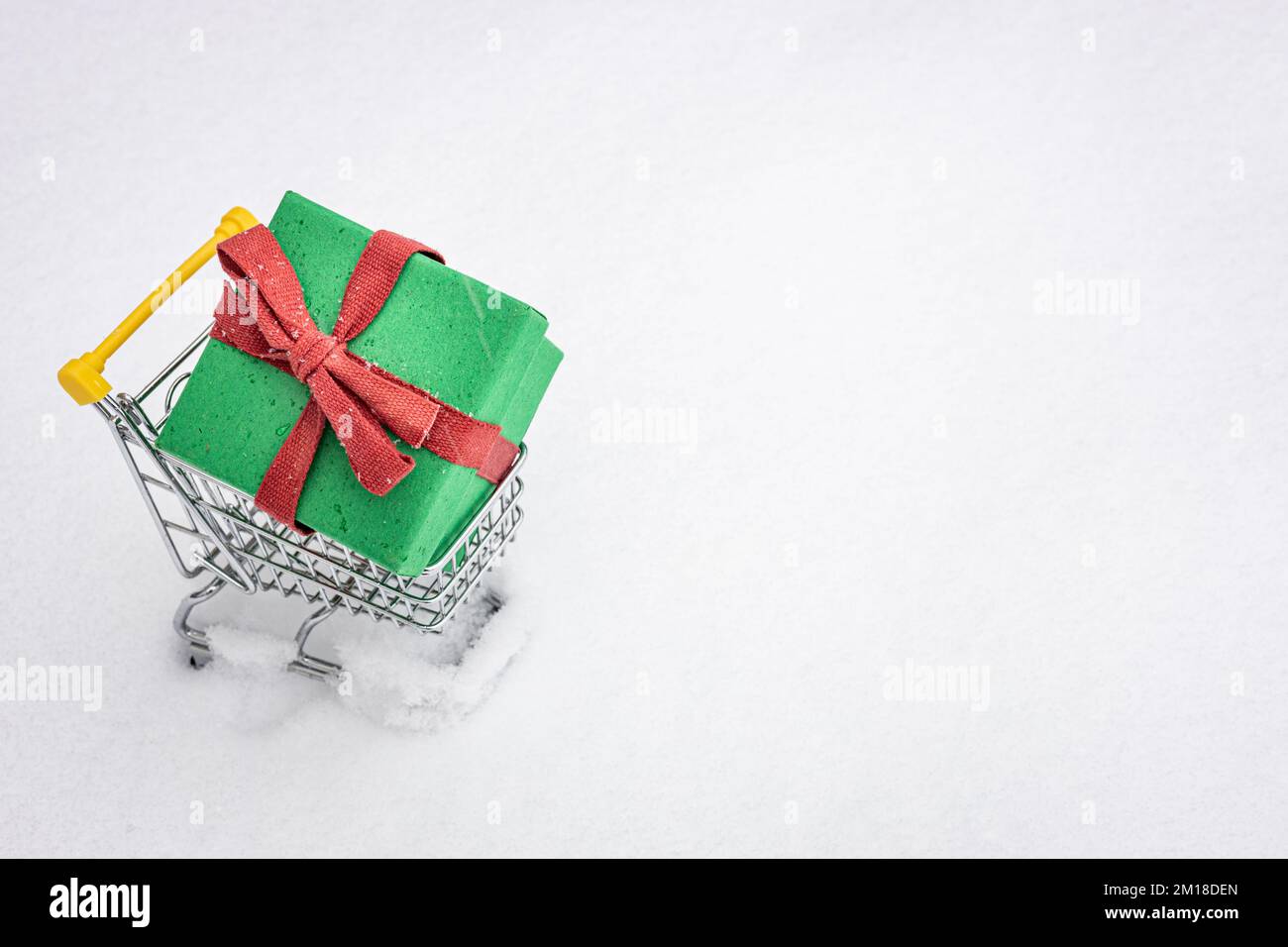 Christmas Gifts, Concept, Shopping cart with a Christmas box buried in ...