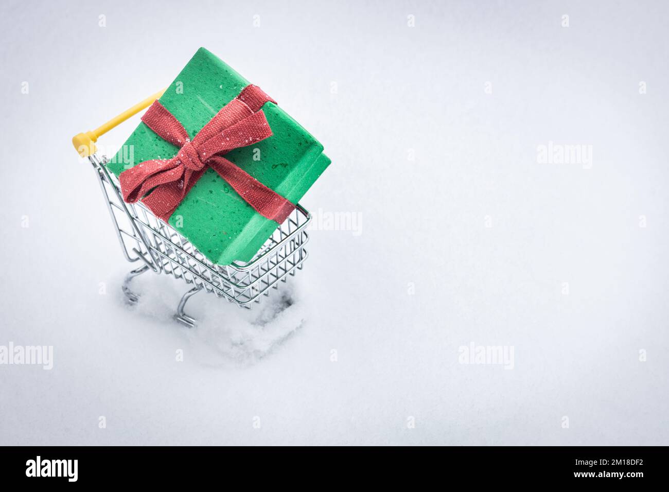 Christmas Gifts, Concept, Shopping cart with a Christmas box buried in ...