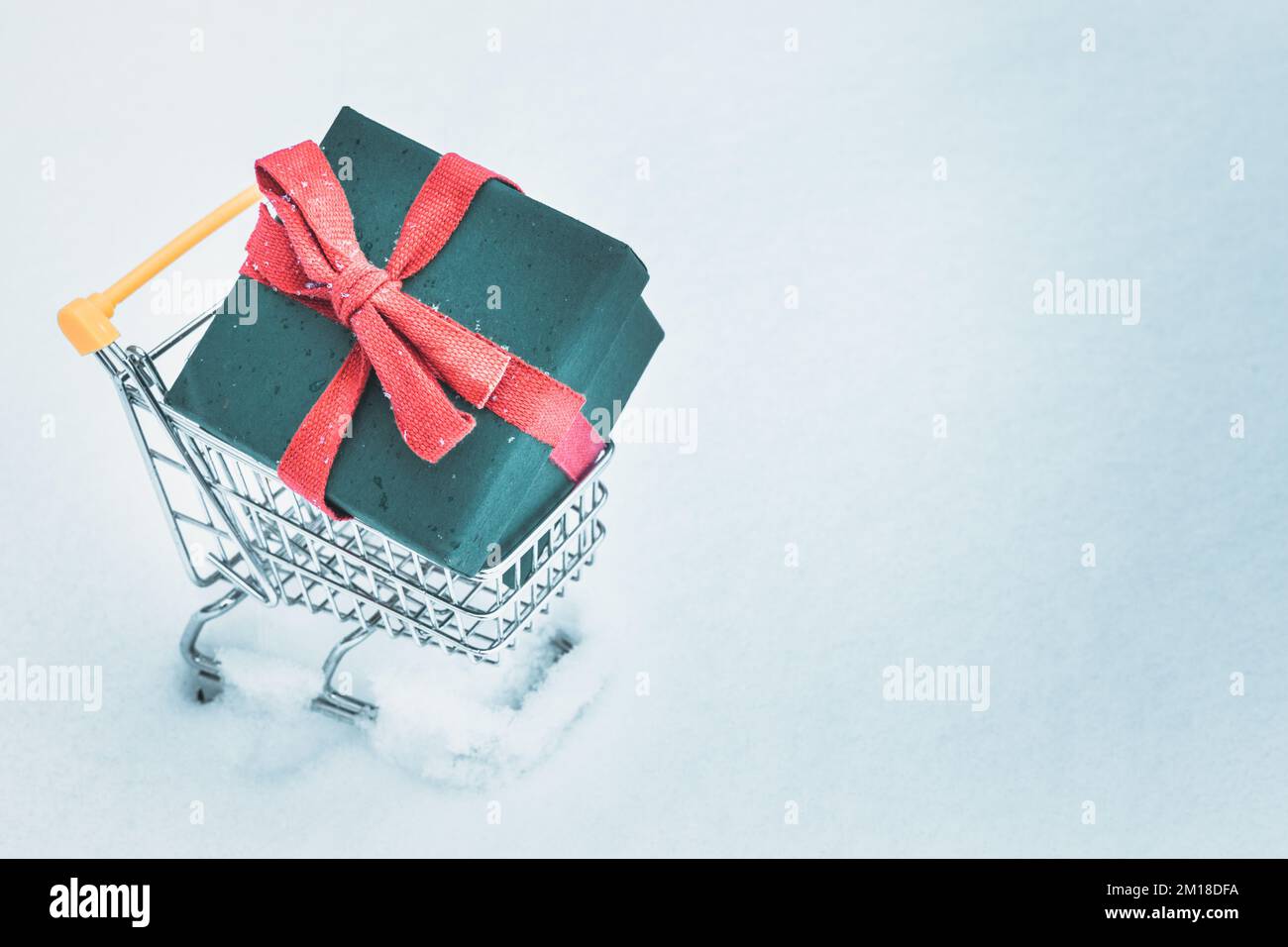 Christmas Gifts, Concept, Shopping cart with a Christmas box buried in ...