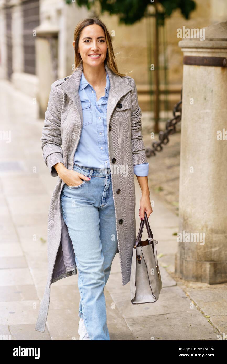 Stylish woman walking hi-res stock photography and images - Alamy