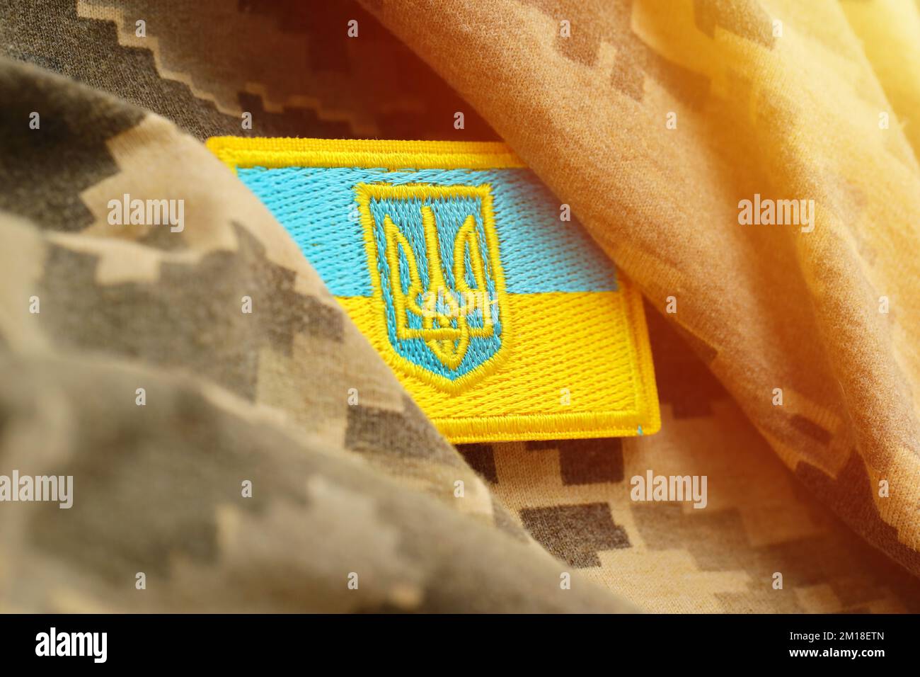 Pixeled digital military camouflage fabric with ukrainian flag and coat ...