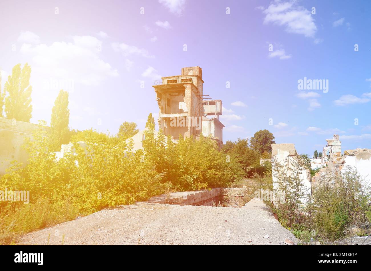 Collapsed industrial multistorey building in daytime. Disaster scene ...