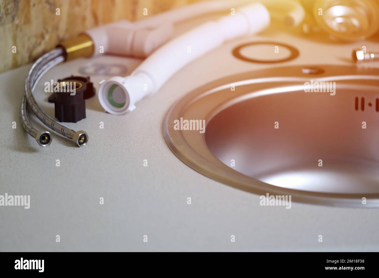 Plumbers tools and water tap ready for installation near sink on ...