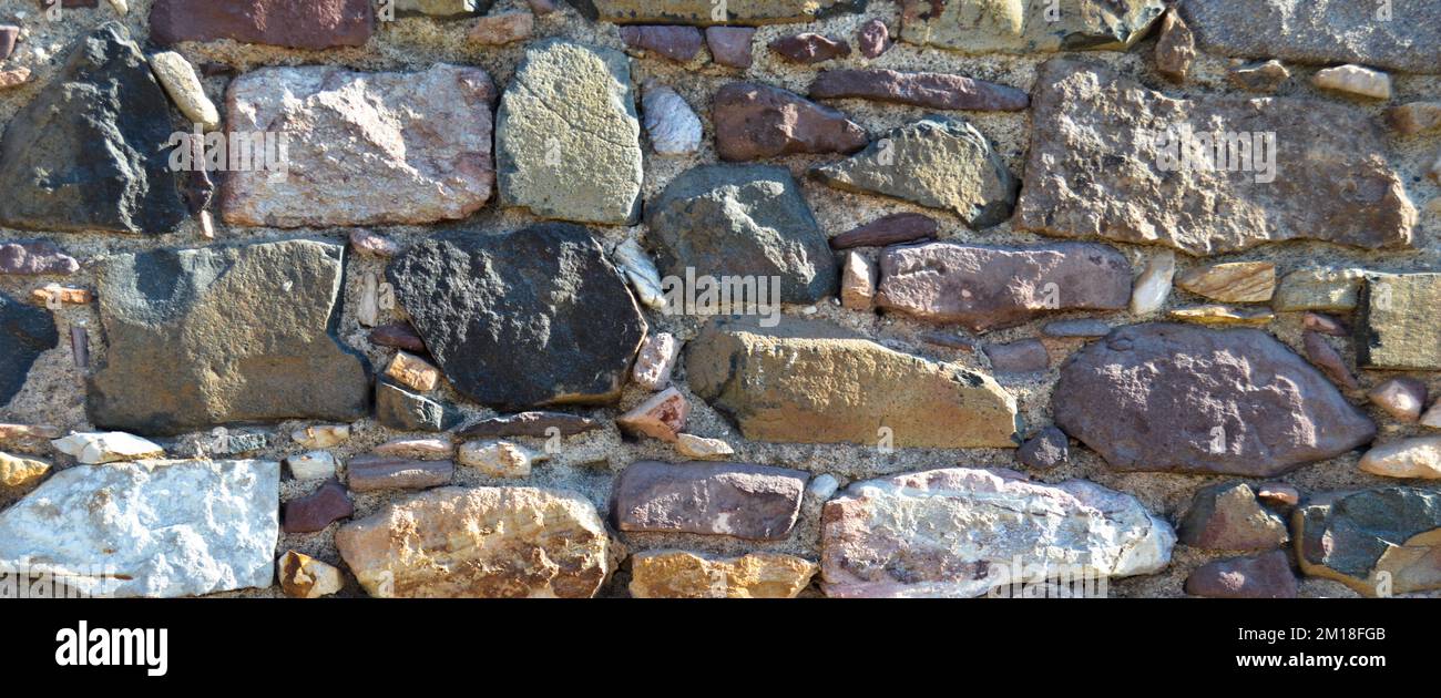 Sturdy beige and purple cut stone wall, good for backgrounds, seamless ...