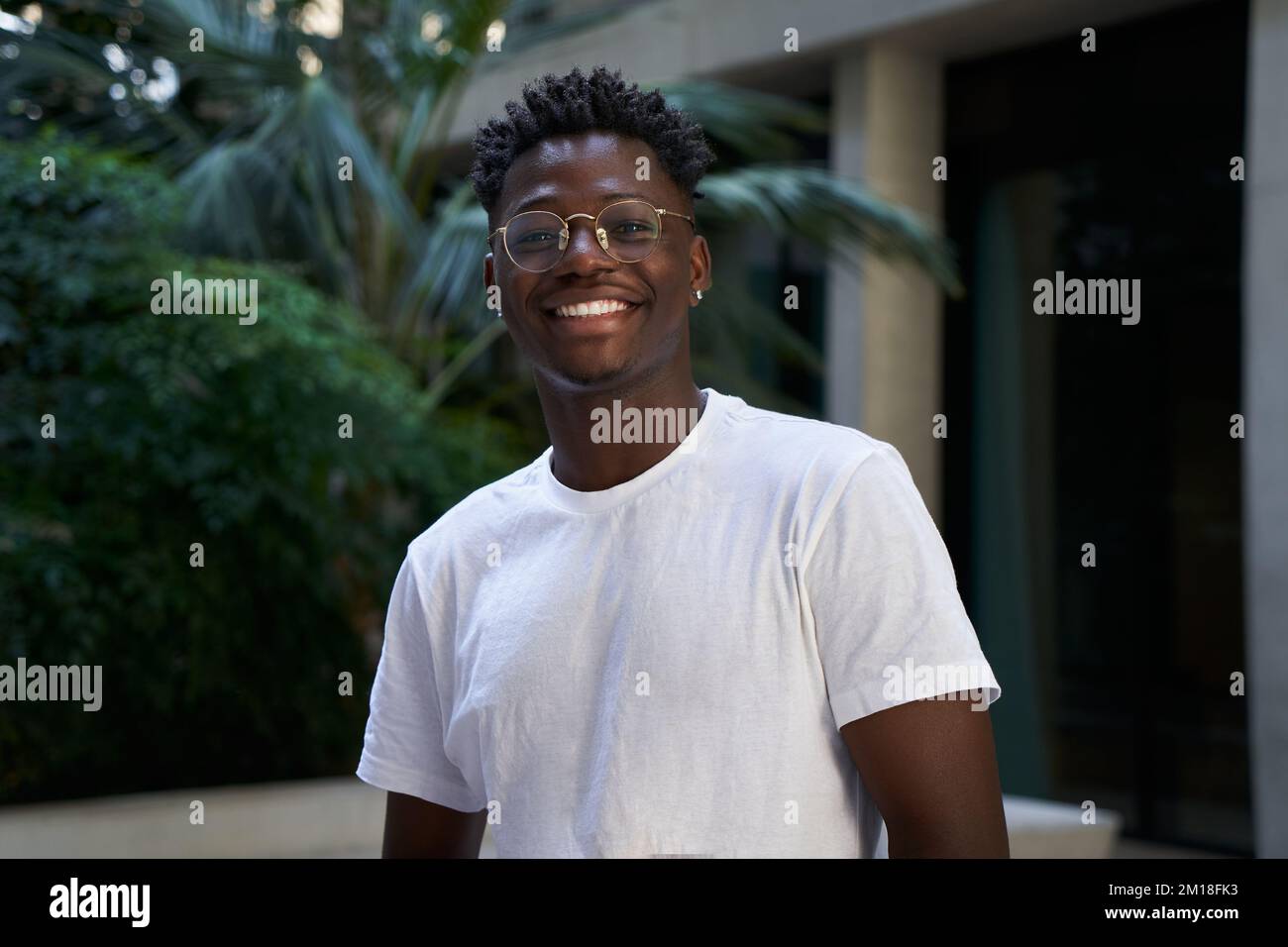Portrait of black man very happy, smiling and looking at camera. An ...