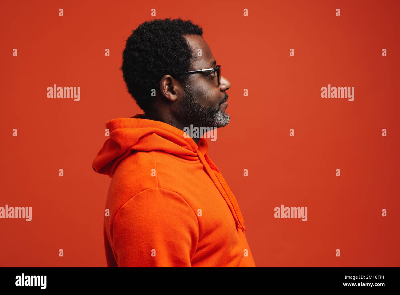 Adult african american man wearing eyeglasses standing in profile ...