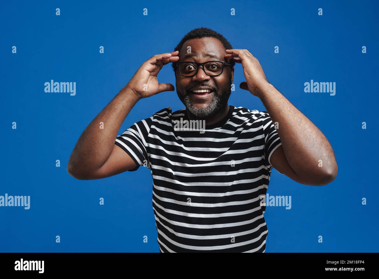 Adult african american man wearing eyeglasses smiling and expressing ...