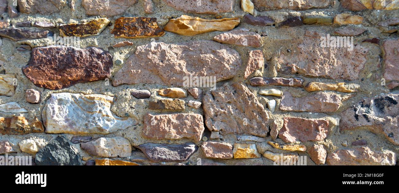 Sturdy beige and purple cut stone wall, good for backgrounds, seamless ...