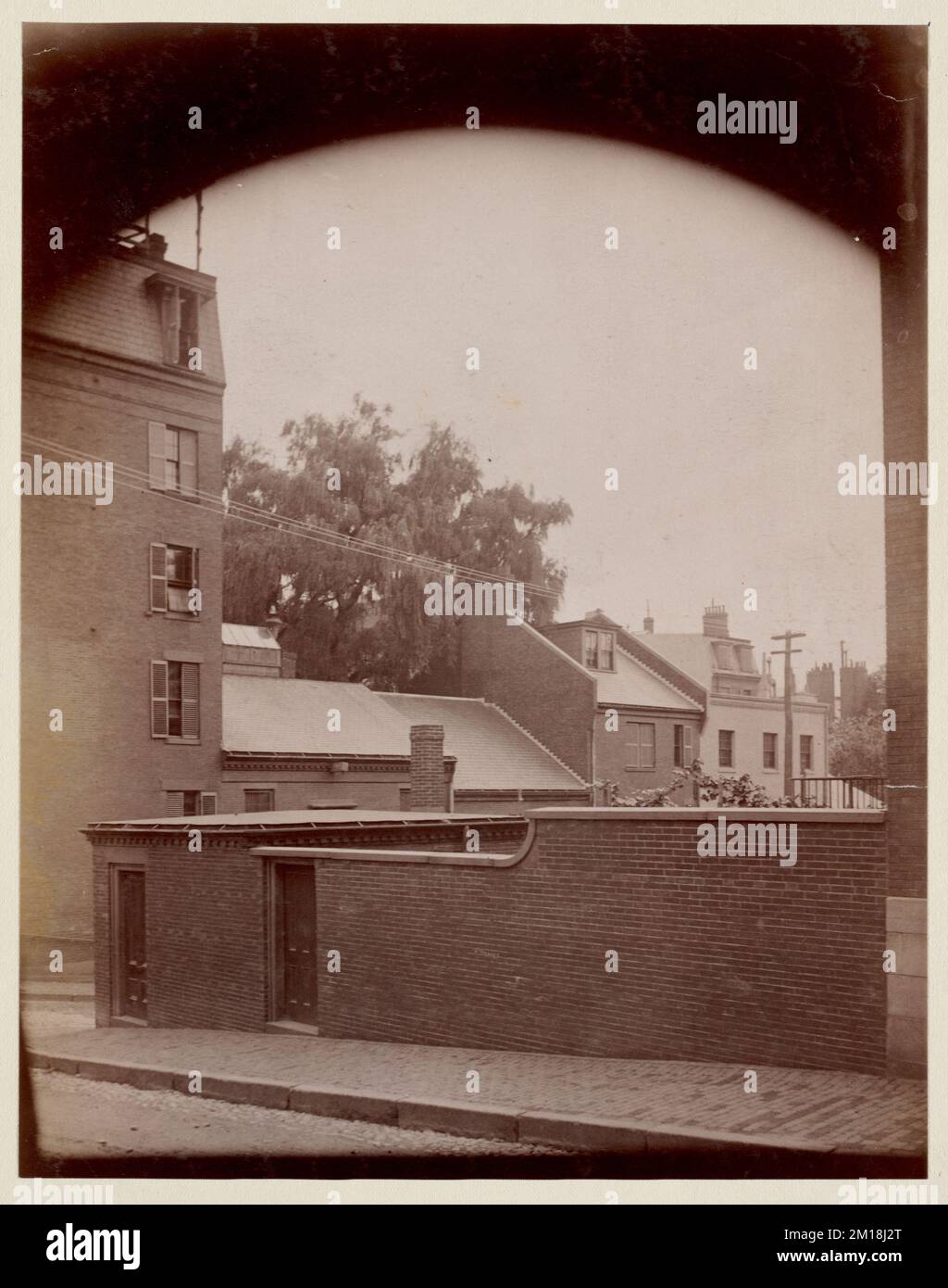 Street view with brick wall , Row houses Stock Photo - Alamy
