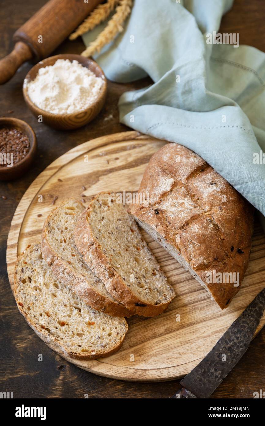 Homemade baking. Bread from whole wheat grains, wheat bran, seeds, bio ...