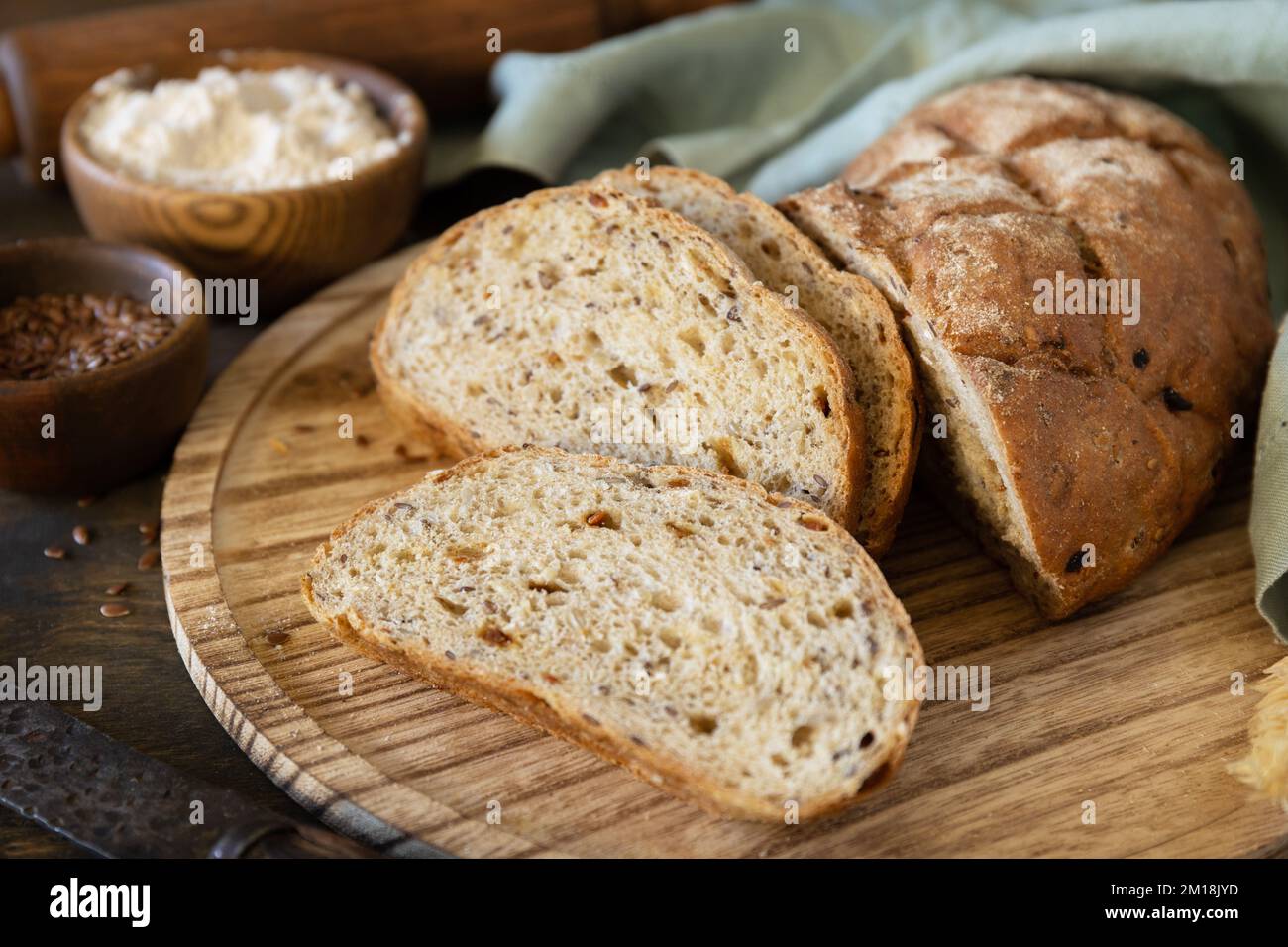 Homemade baking. Bread from whole wheat grains, wheat bran, seeds, bio ...