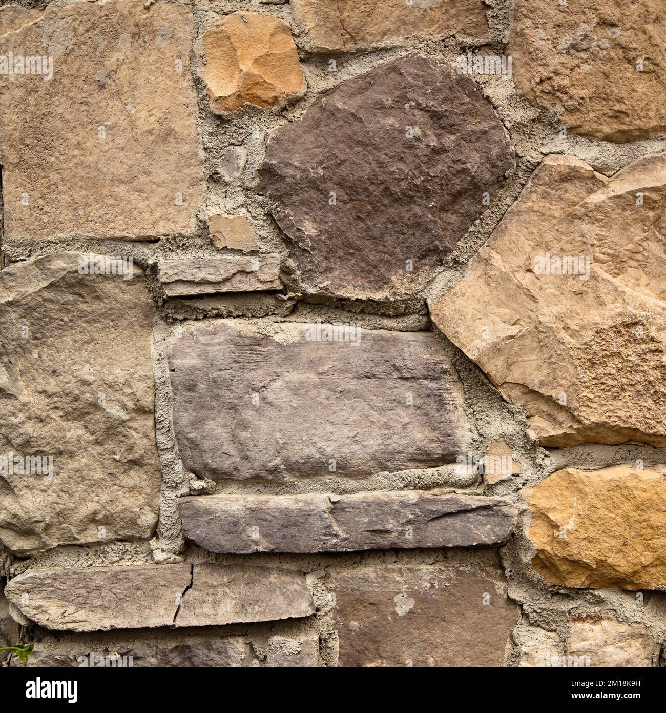 Sturdy yellow and beige cut stone wall, good for backgrounds, seamless ...