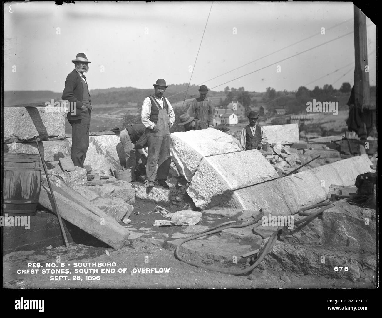 Sudbury Reservoir, laying crest stone at south end of overflow ...