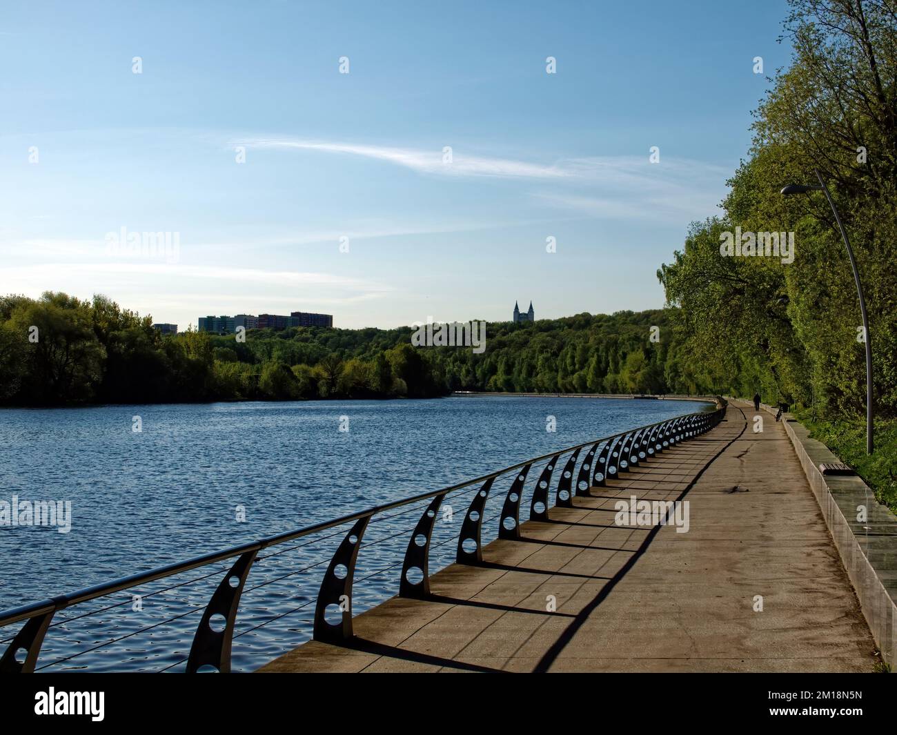 river embankment made of concrete slabs on a clear day, in summer Stock ...