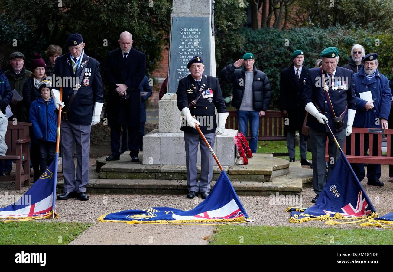 Standards are lowered as the Last Post is played during a ceremony in ...