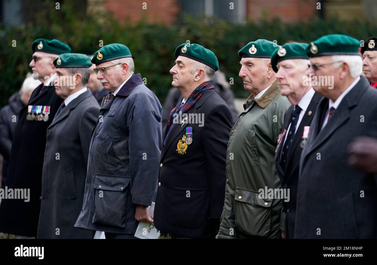 Veterans line up during a ceremony in the Royal Marines Memorial ...