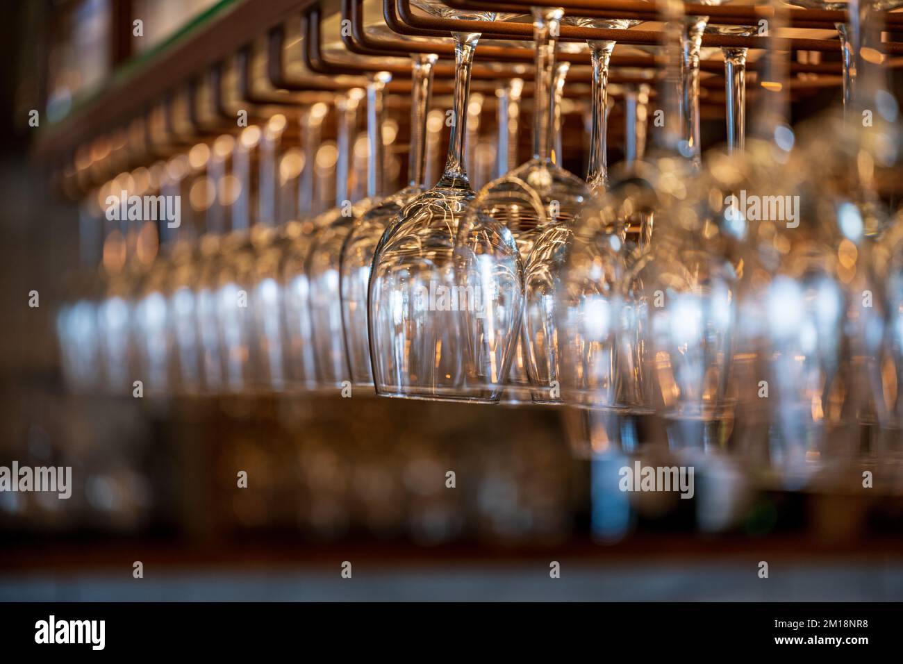 A beautiful view of hung wine glasses for background use Stock Photo ...