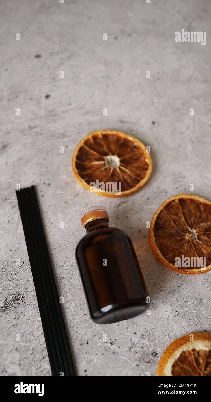 Citrus reed diffuser, dark background. Homemade diffuser. Creating cozy ...