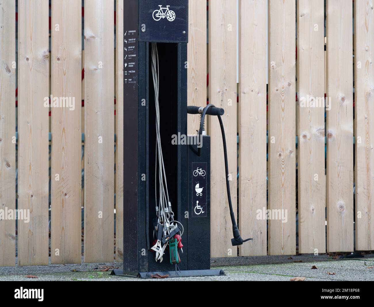 Bike maintenance tool kit fixed to staff cycle shed Stock Photo - Alamy