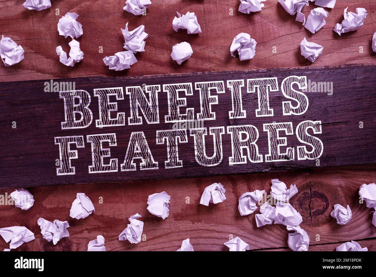 Hand writing sign Benefits Features. Concept meaning Making a product ...