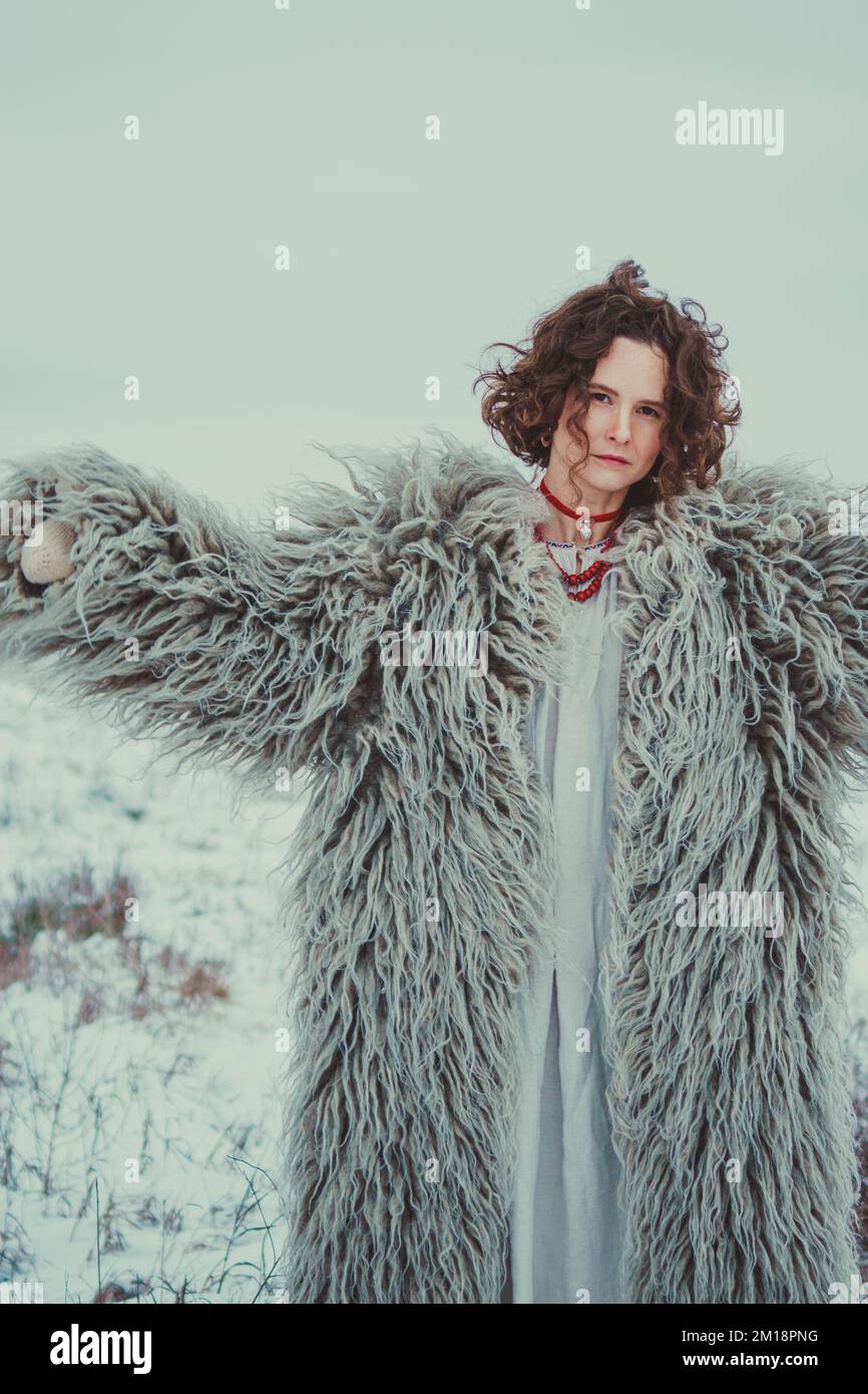 Woman in Historical Ukrainian winter clothing - gunia, sheepskin coat ...