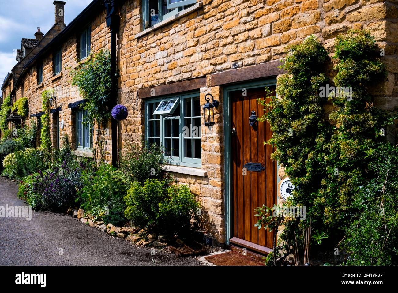 Terraced stone houses in the village of Longborough on The Heart of ...