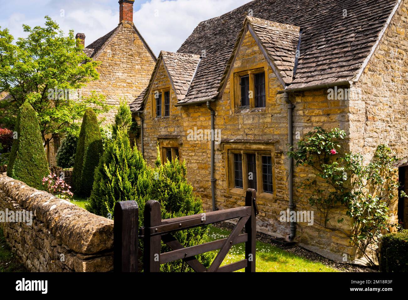 Cotswolds stone houses on The Heart of England Way public path through ...