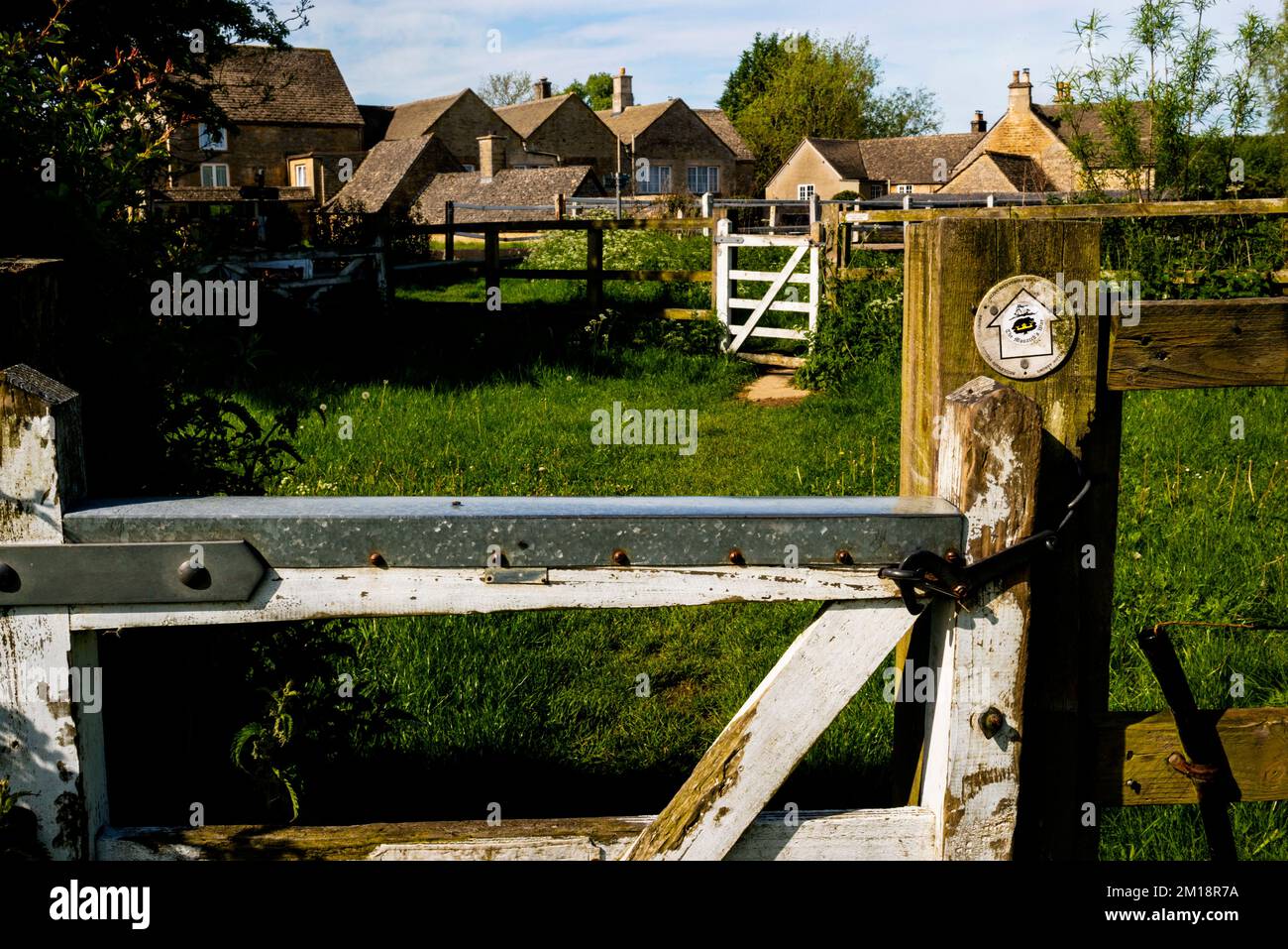 Cotswolds stone houses and The Monarch's Way public path in Lower ...