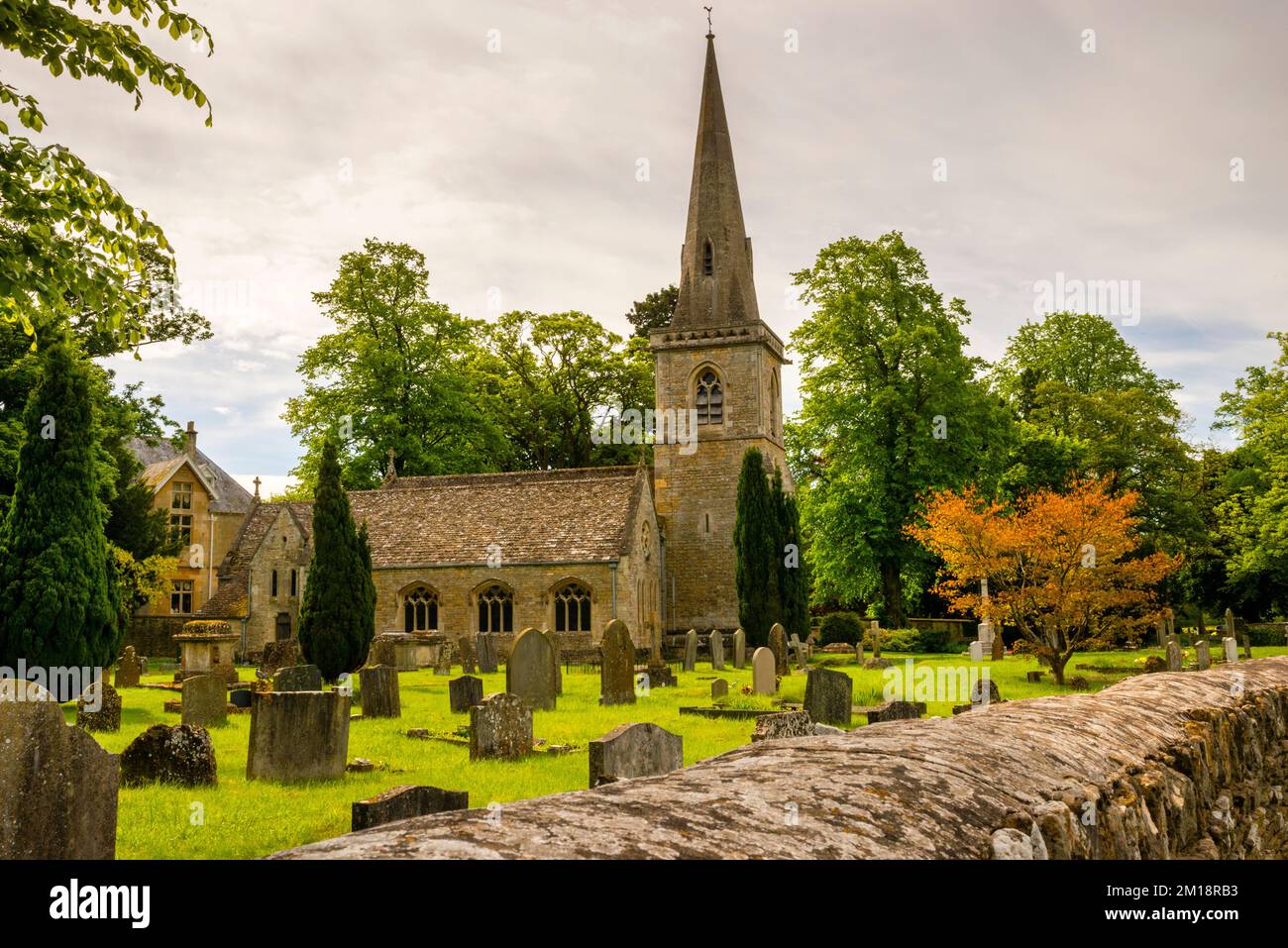 The spire of Church of Saint Mary in the Cotswold village of Lower ...