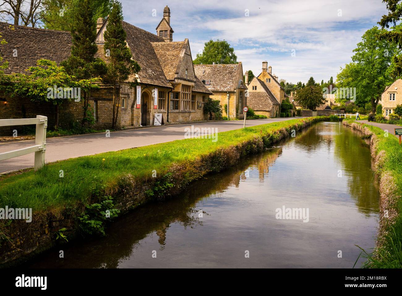 The Eye River flows through the Cotswold village of Lower Slaughter in ...