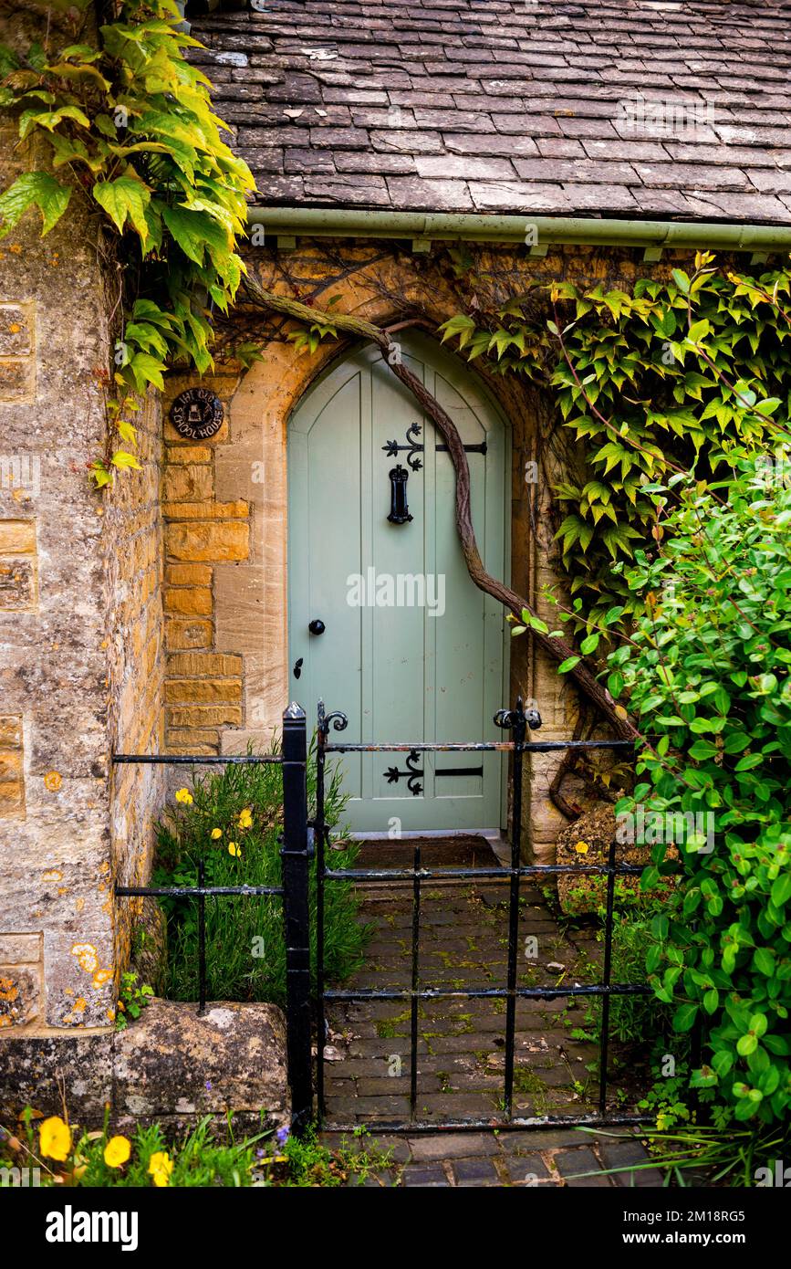 Lovely doorway in Lower Slaughter with an espalier tree and pointed ...