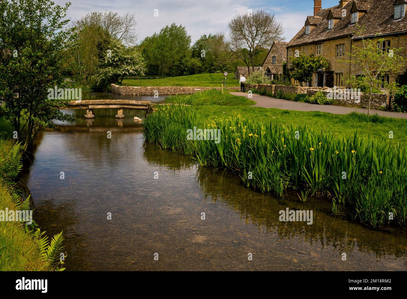 Stone footbridge over the Rye River in Lower Slaughter, Cotswoolds ...