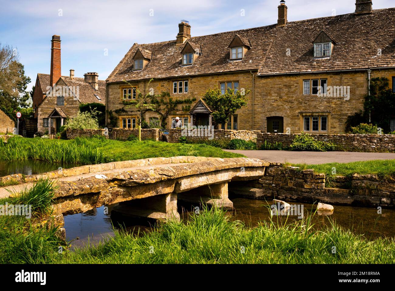 Footbridge over the Rye River in Lower Slaughter, Cotswolds, England ...