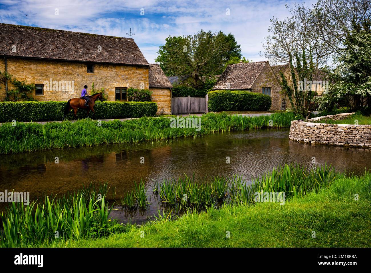 Gold color limestone buildings in Lower Slaughter, England Stock Photo ...