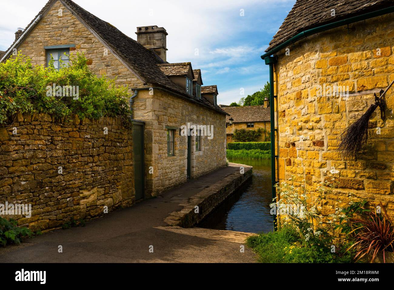 Dormers and pedestrian footpath in Lower Slaughter, the Cotswolds ...