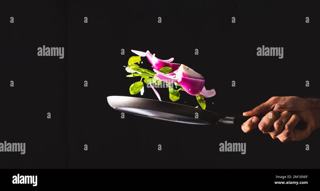 Making Brazilian-style Ceviche on Black Background. Frying Pan Throwing ...