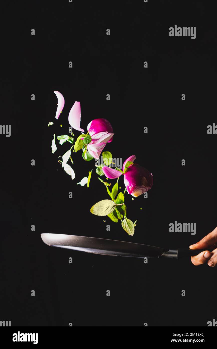 Making Brazilian-style Ceviche on Black Background. Frying Pan Throwing ...